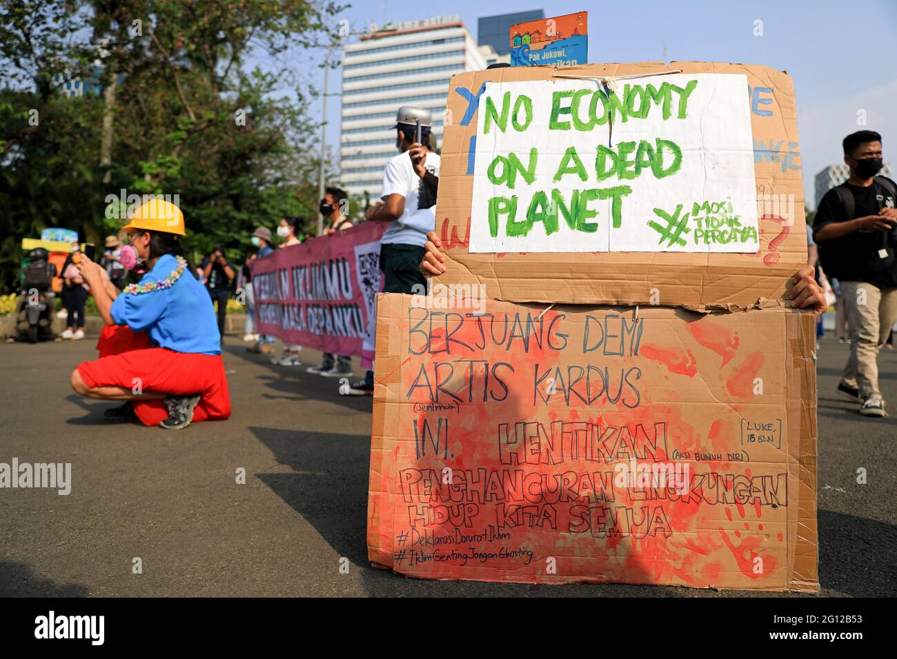 An activist holding placards expressing his opinion ahead of World ...