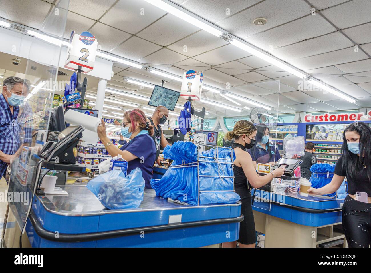 Cashier working employee worker customer hispanic hi-res stock ...