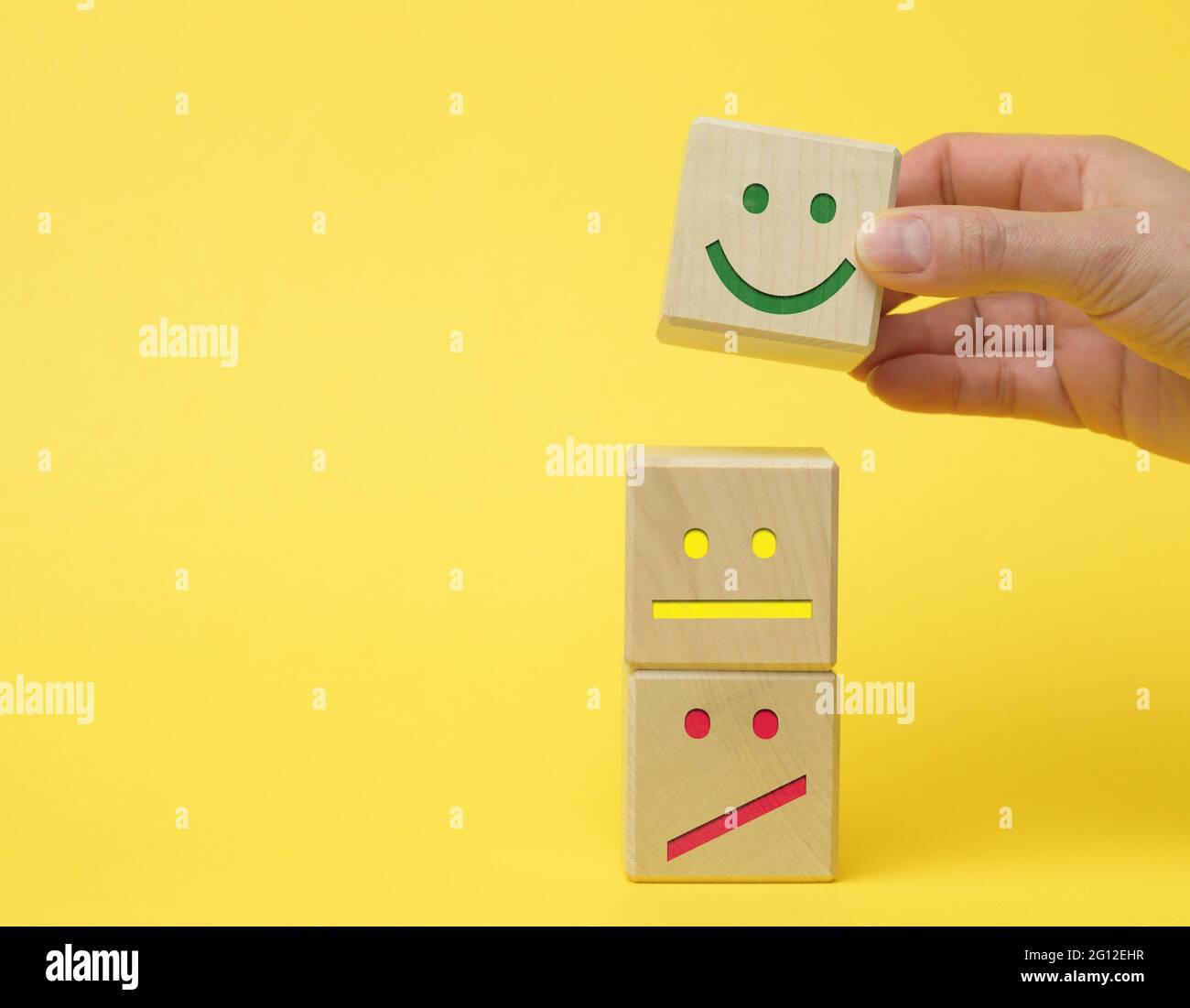 Hand choosing wooden block hi-res stock photography and images - Alamy