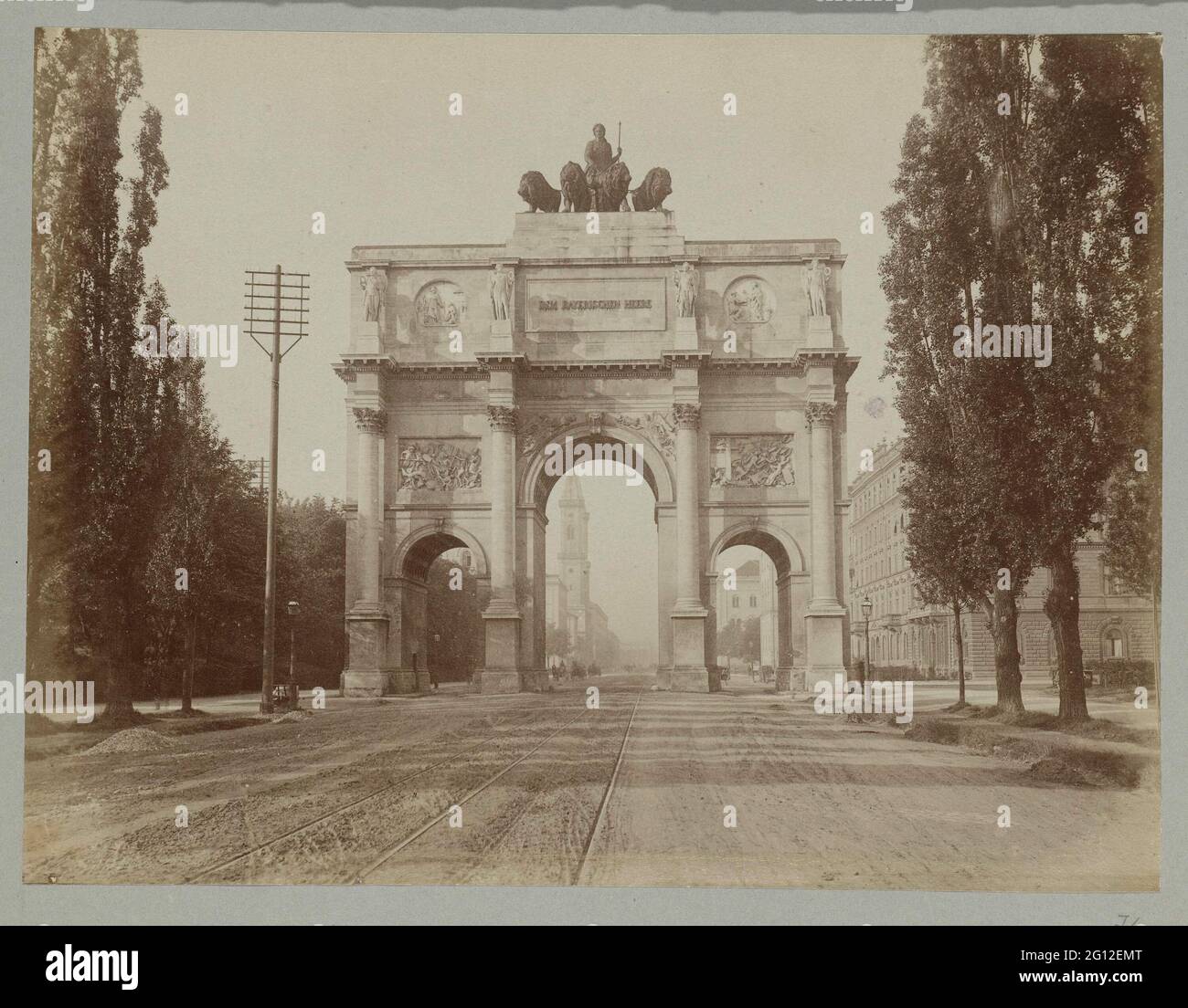 City gate in Munich; Munich. A city gate with ornaments and on top of ...