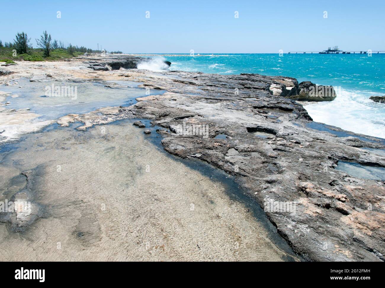 The view of wet eroded coastline with waves in a background on Grand ...