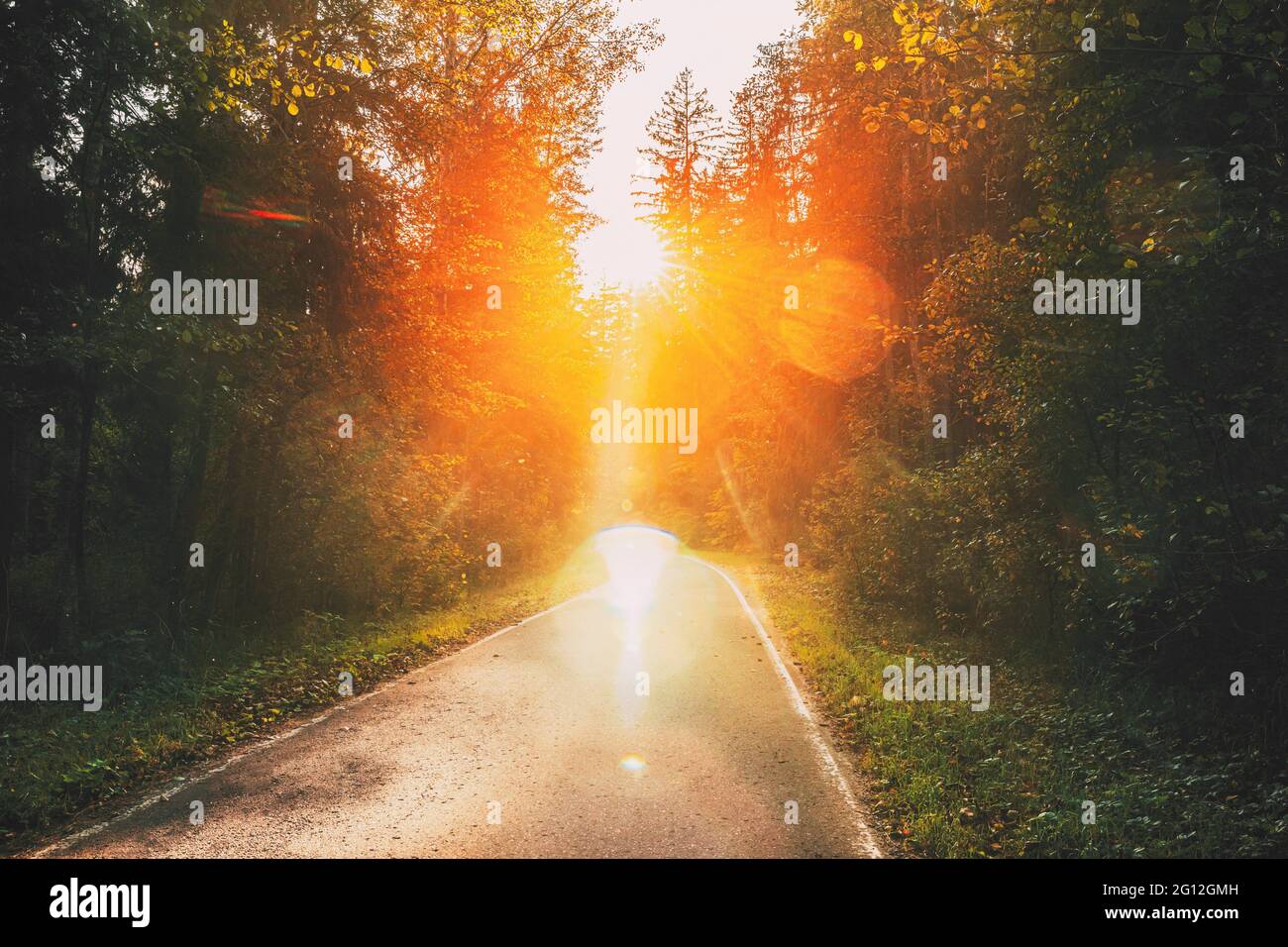 Winding road at sunset hi-res stock photography and images - Alamy
