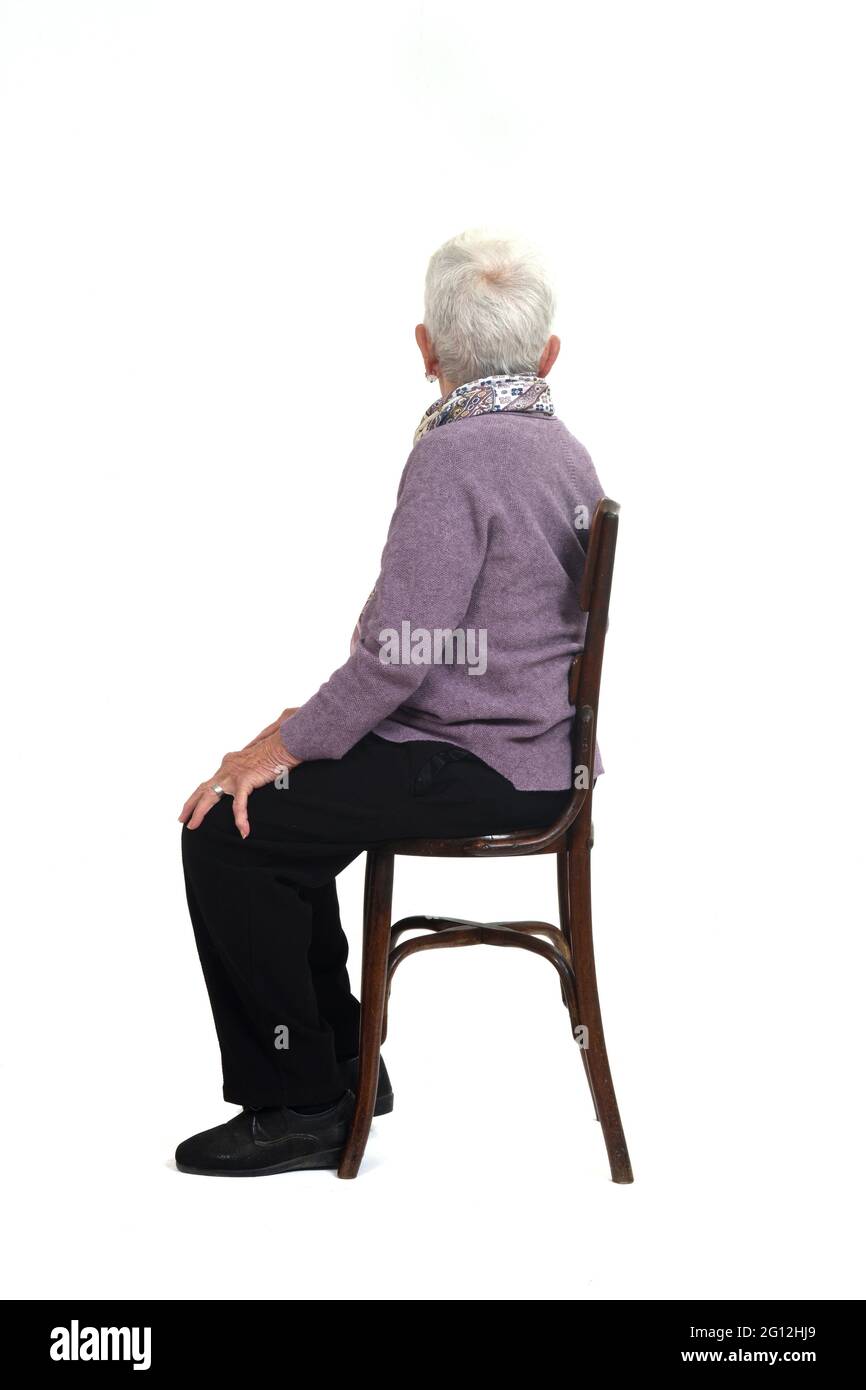 Old woman sitting side view chair Cut Out Stock Images & Pictures - Alamy