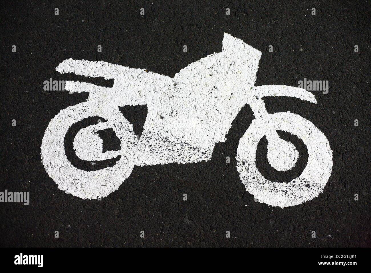 Motorcycle symbol painted on tarmac Stock Photo - Alamy
