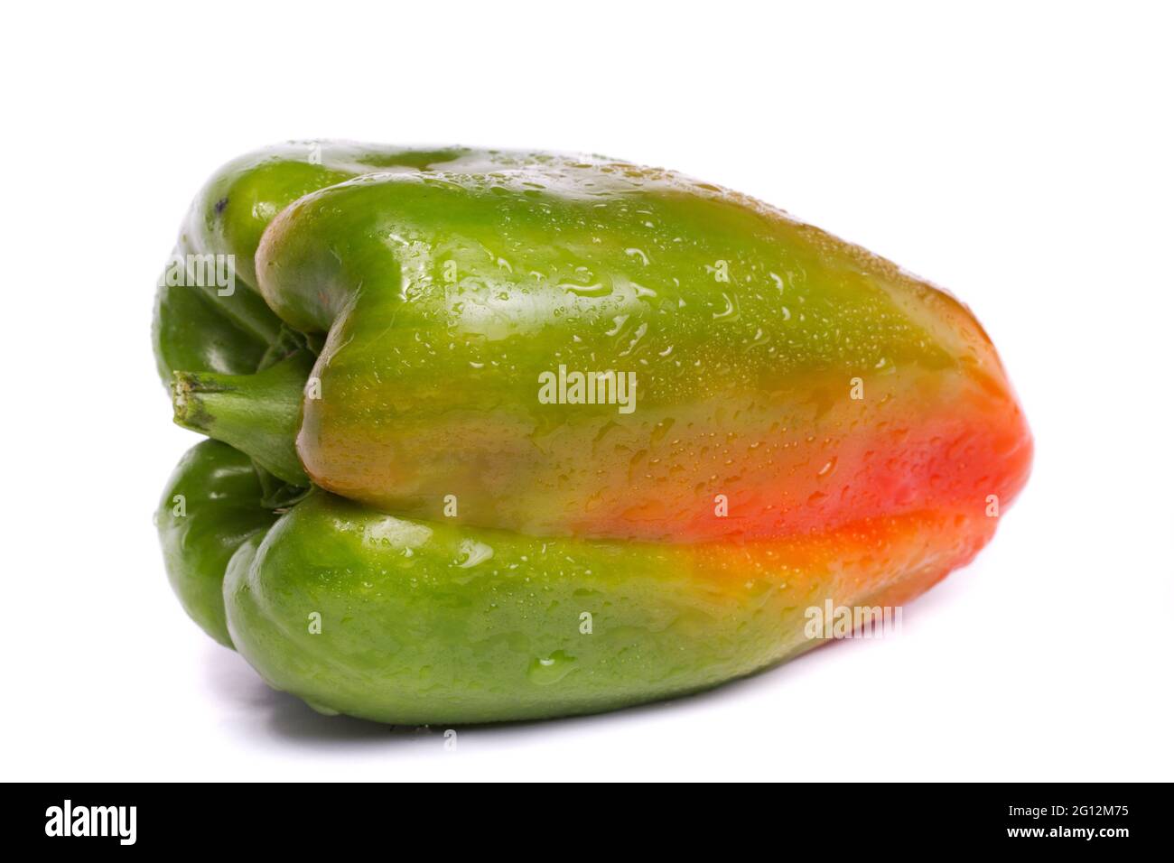 Close up view of a fresh green bell pepper isolated on a white ...