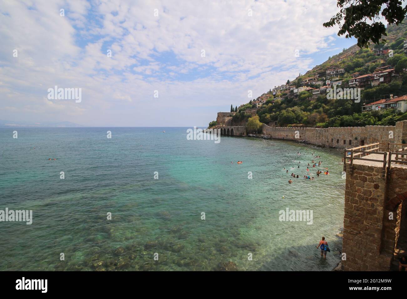 The historical Kızıl Kule (Red Tower), castle wall and ruins of ...
