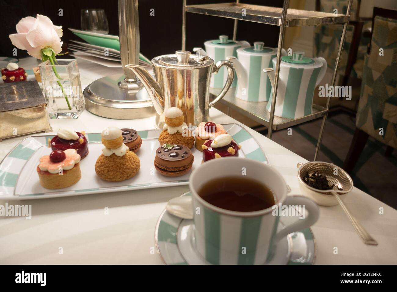 A fine table serving of afternoon tea with cakes, at Claridges Bar ...