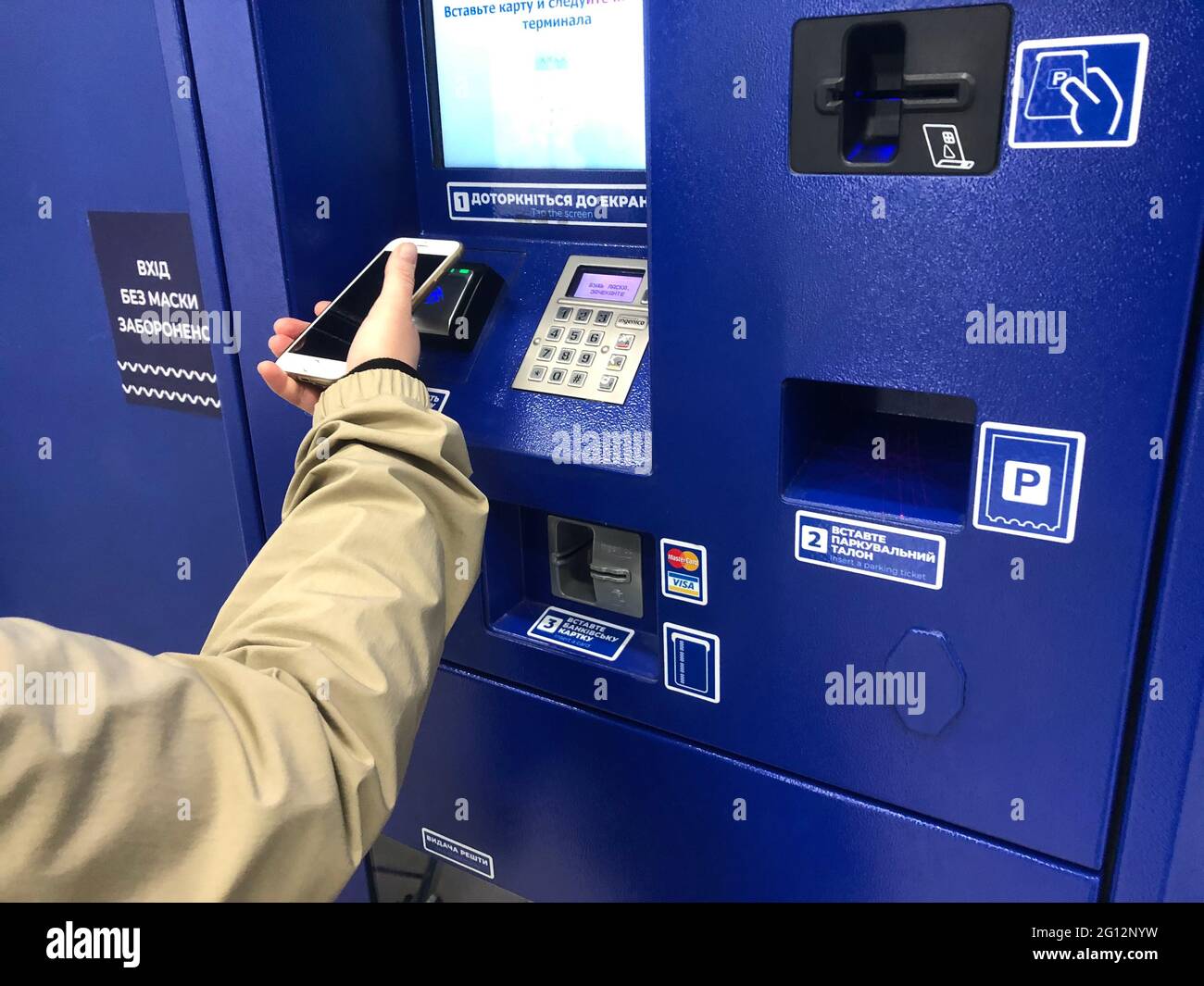 Woman using parking meter hi-res stock photography and images - Alamy