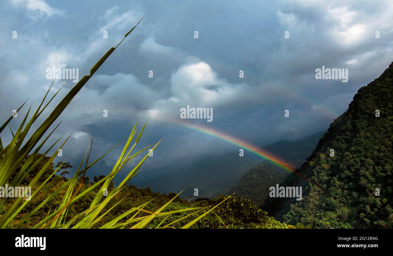 Beautiful rainbow on cloudy sky over Himalayan mountains at Sikkim ...