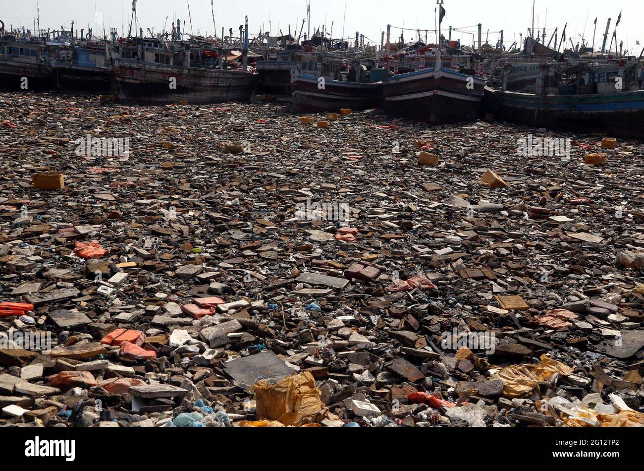 View of filthy water that fills with huge heap of garbage creating ...
