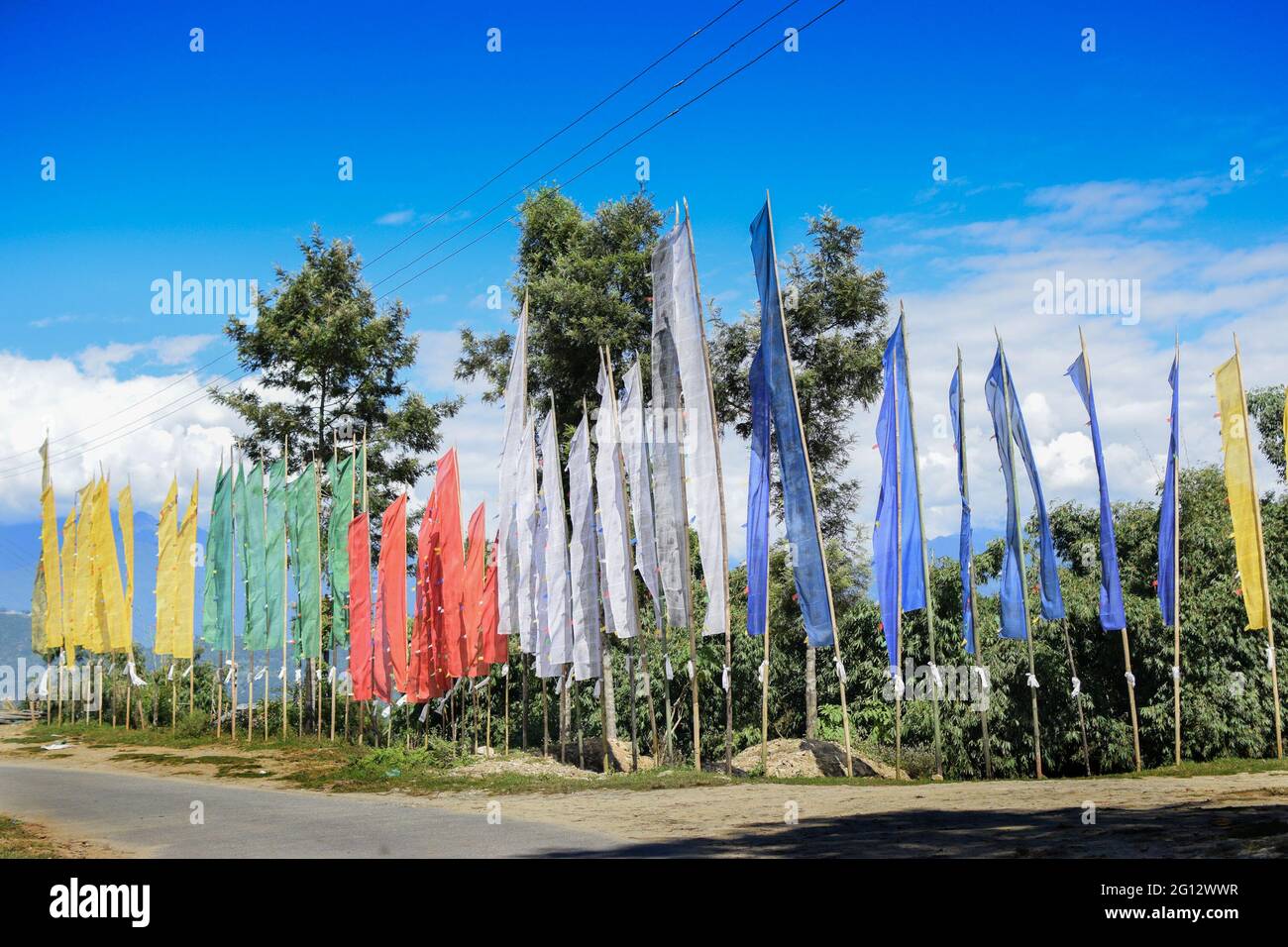Colourful prayer flags, Buddhist religious symbol - with rising sun ...