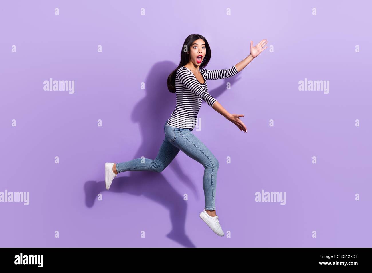 Full size profile side photo of shocked amazed young girl running in ...