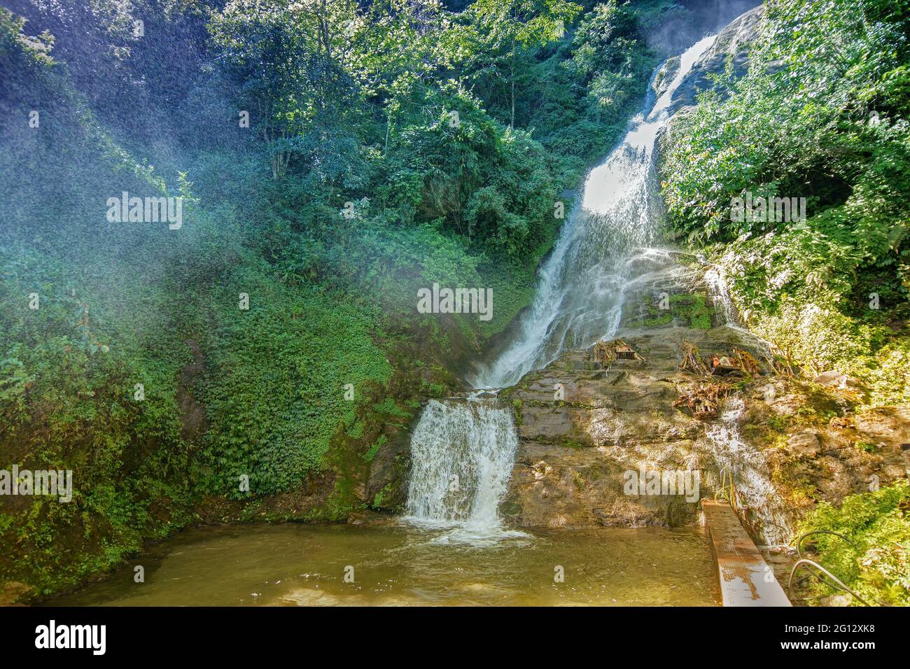 A beautiful waterfall at Sikkim , India. Water is coming down passing ...
