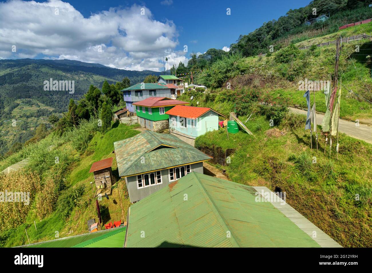 Okhrey village, Himalayan mountain range in the backgroud . Okhrey is a ...