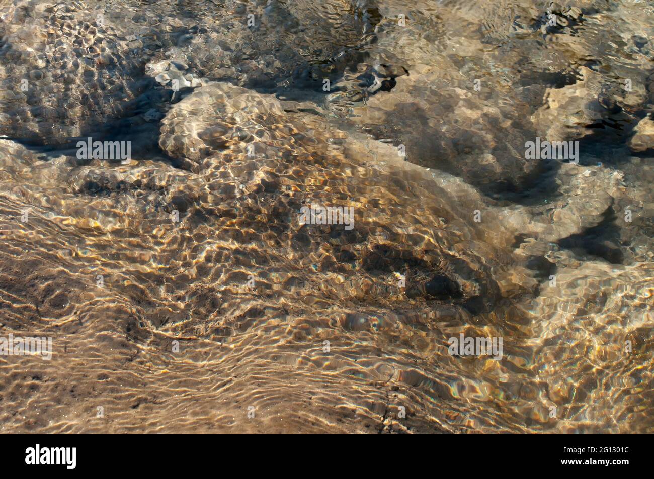 Sunrays reflecting from stones and rocks underwater - creating ...