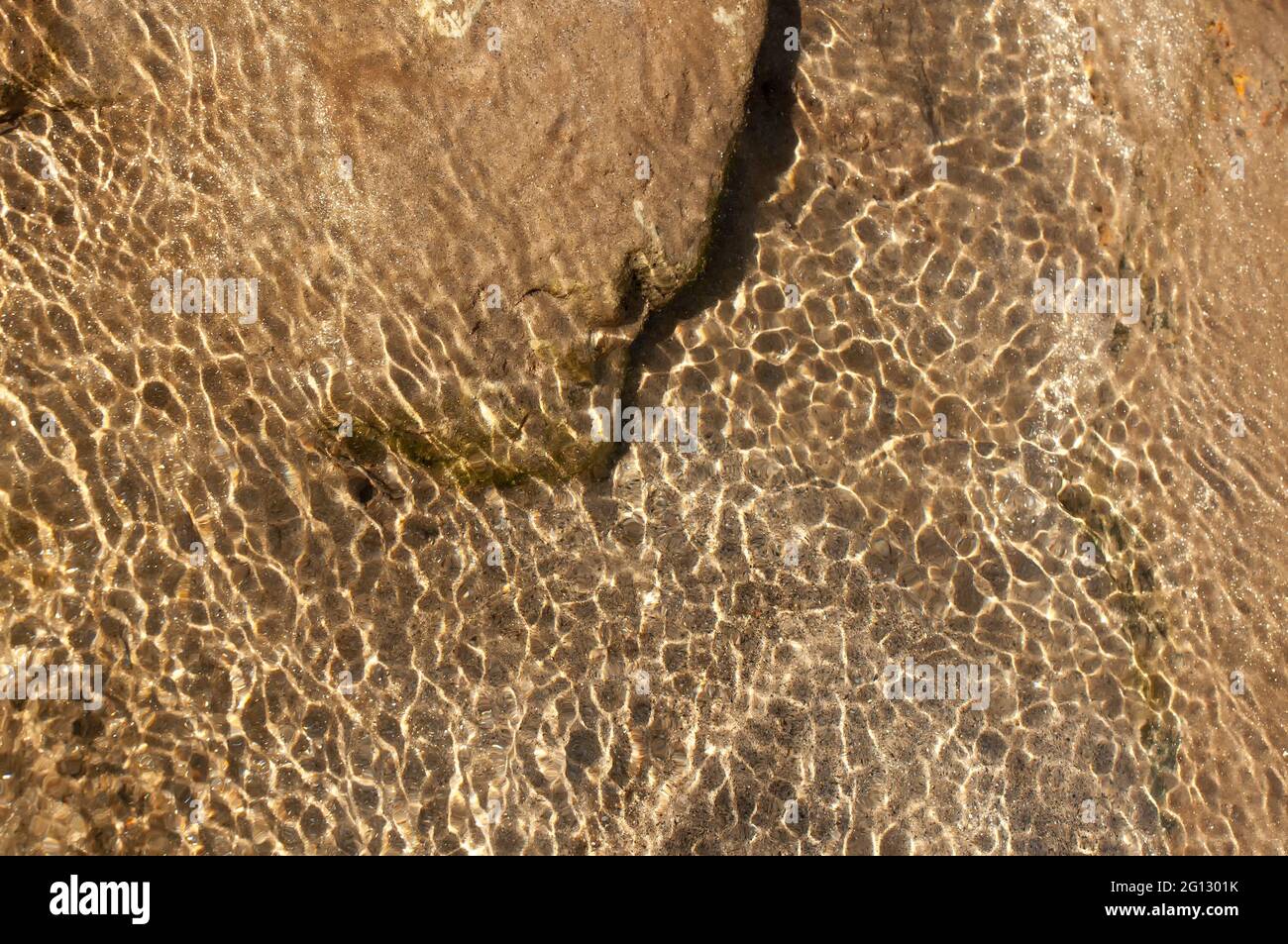 Sunrays reflecting from stones and rocks underwater - creating ...