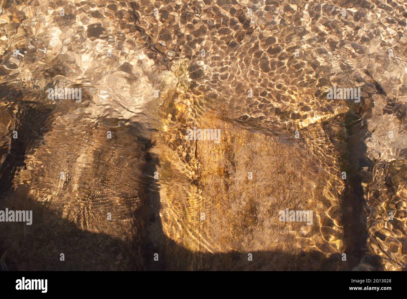 Sunrays reflecting from stones and rocks underwater - creating ...