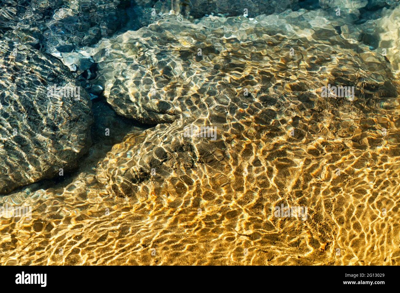 Reflection of sunlight on the underwater stones and rocks of Reshi ...