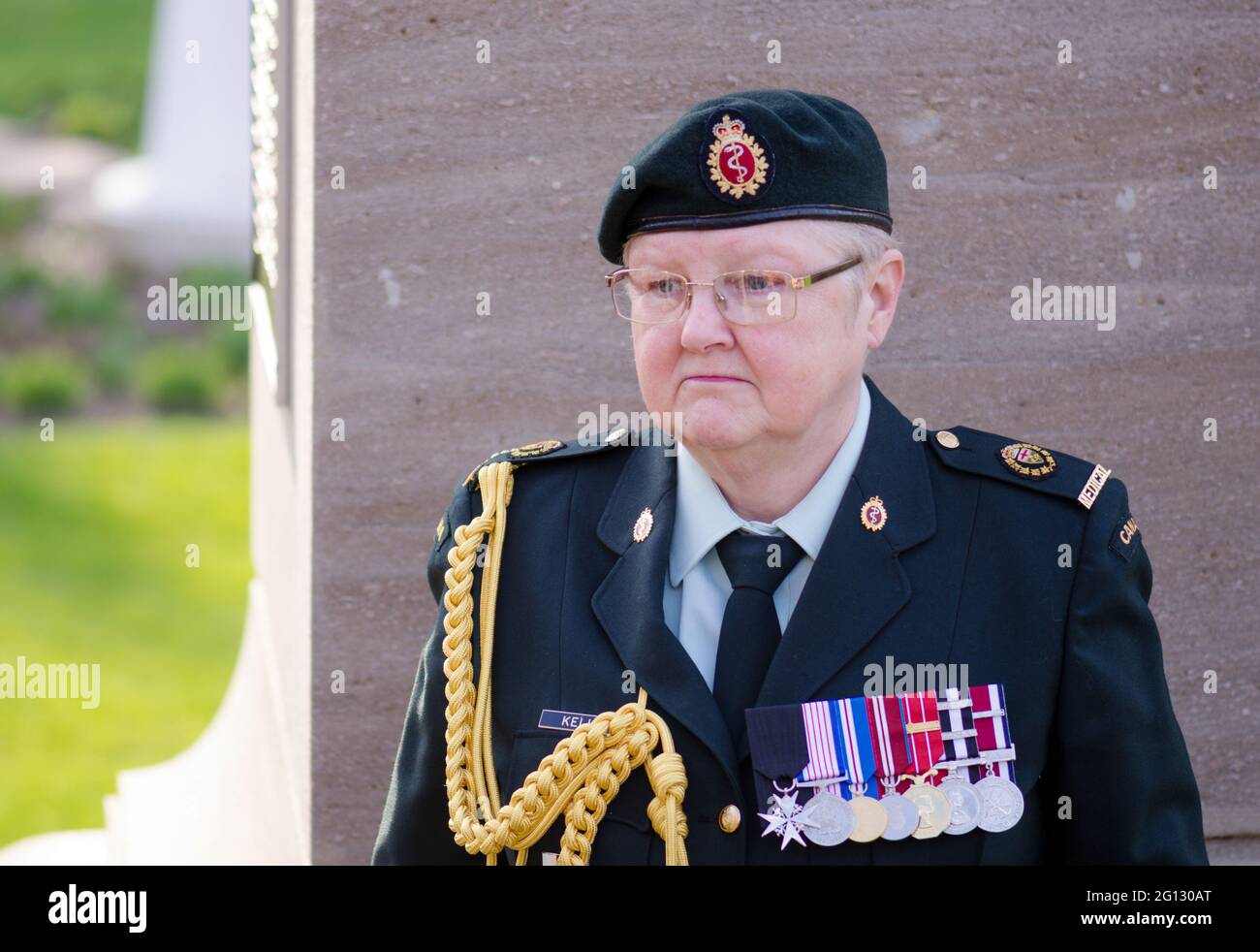Senior woman soldier, Canadian World War II veteran wearing uniform and ...