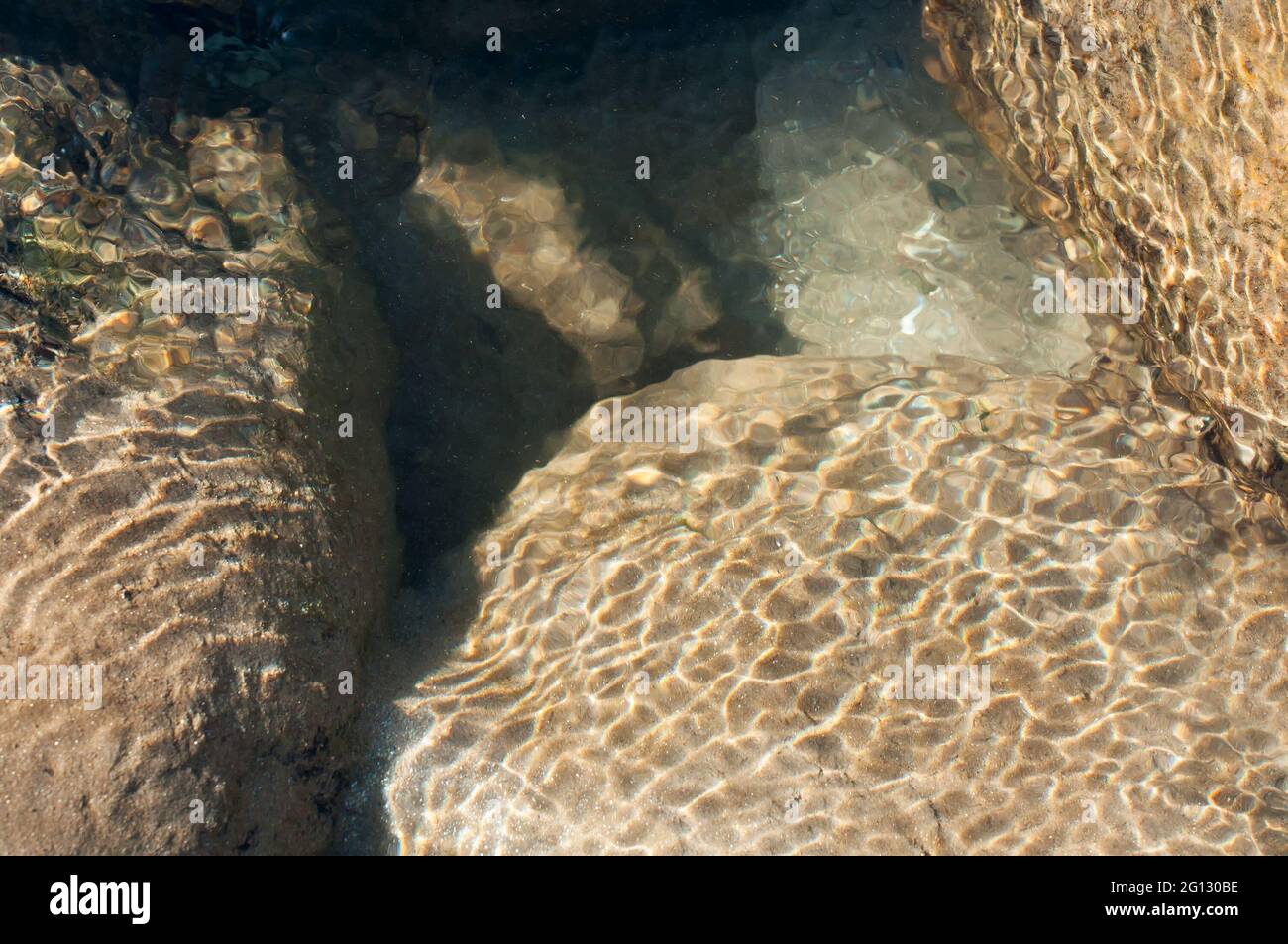 Sunrays reflecting from stones and rocks underwater - creating ...