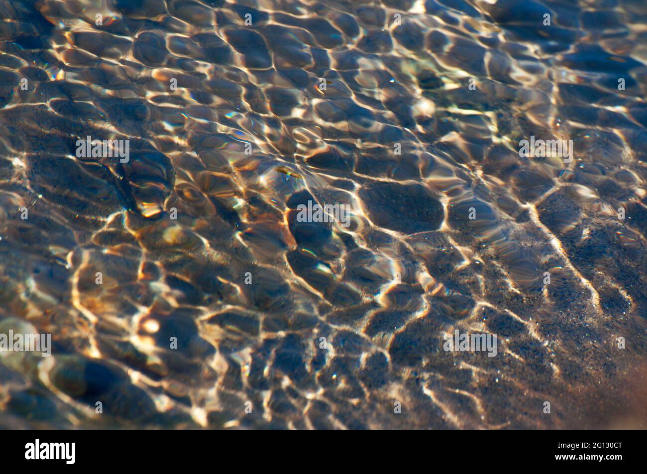 Sunrays reflecting from stones and rocks underwater - creating ...