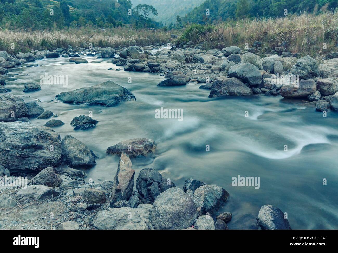 Beautiful Reshi River water flowing through stones and rocks at dawn ...