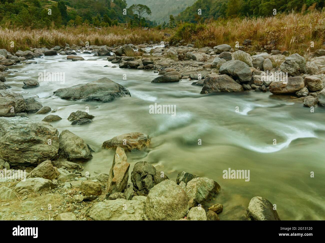 Beautiful Reshi River water flowing through stones and rocks at dawn ...