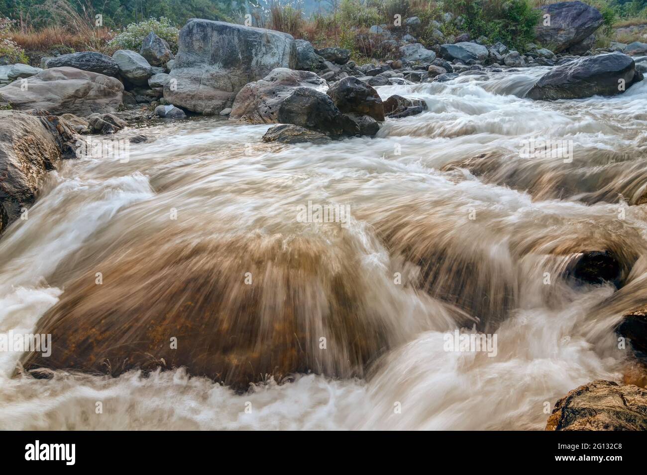 Beautiful Reshi River water flowing through stones and rocks at dawn ...