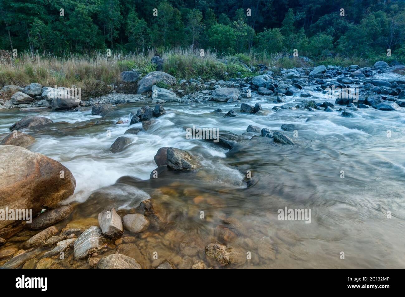 Beautiful Reshi River water flowing through stones and rocks at dawn ...