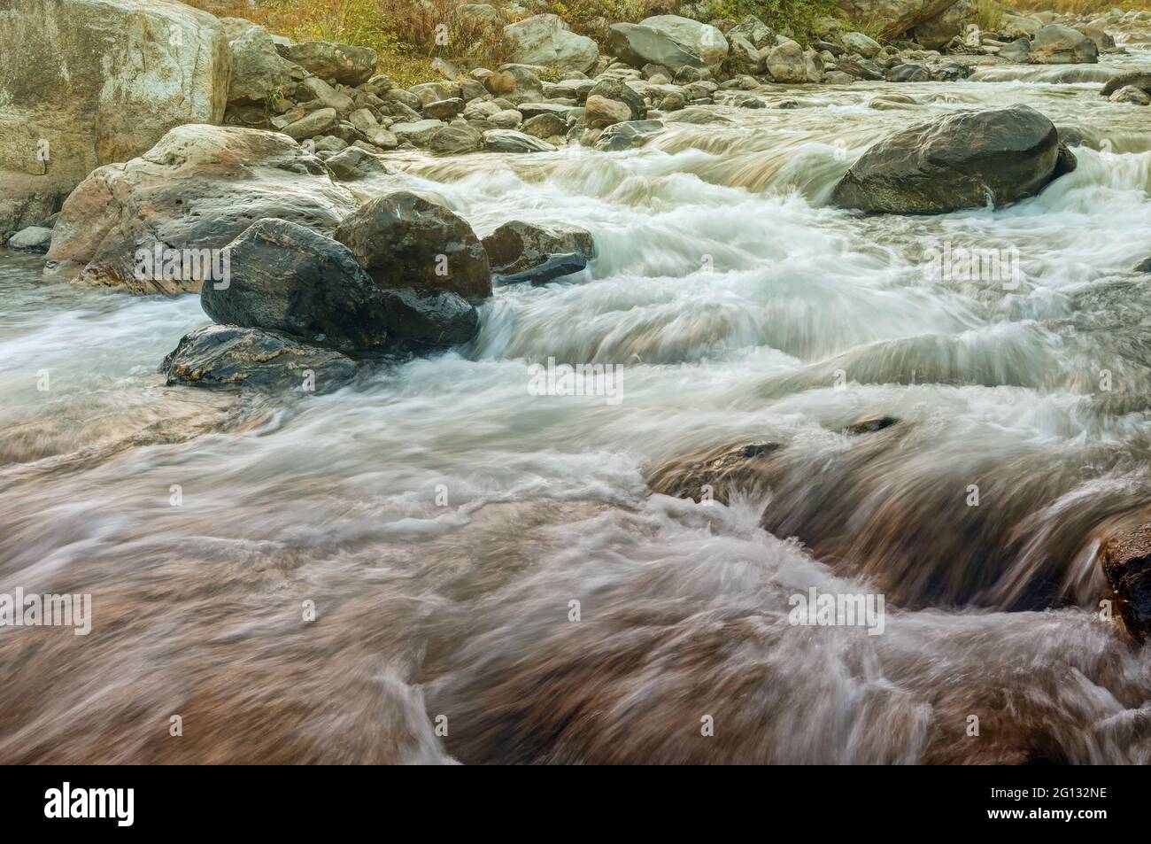 Beautiful Reshi River water flowing through stones and rocks at dawn ...