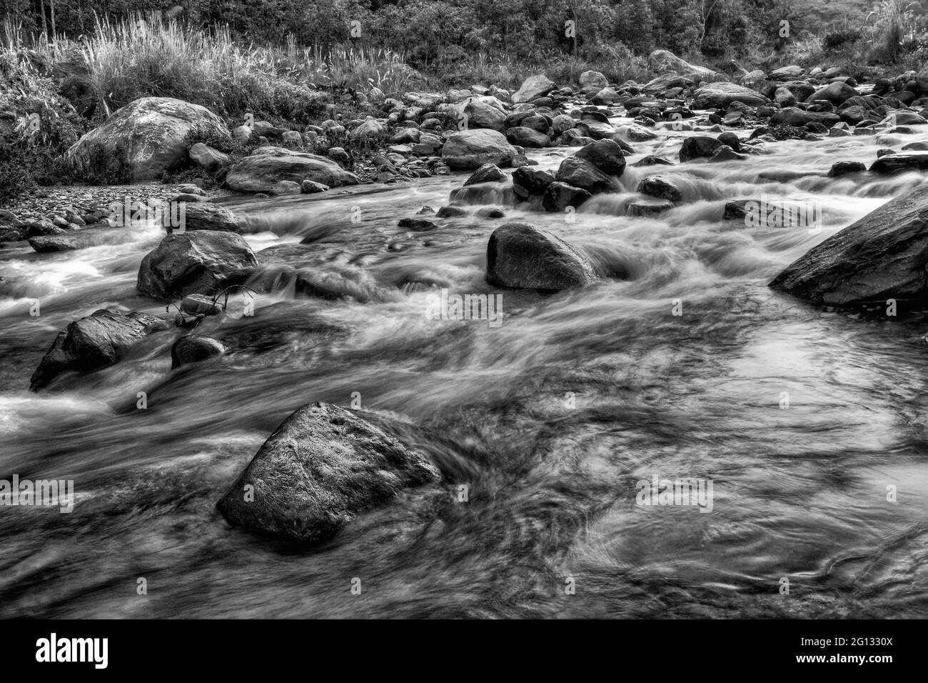 Beautiful Reshi River water flowing through stones and rocks at dawn ...