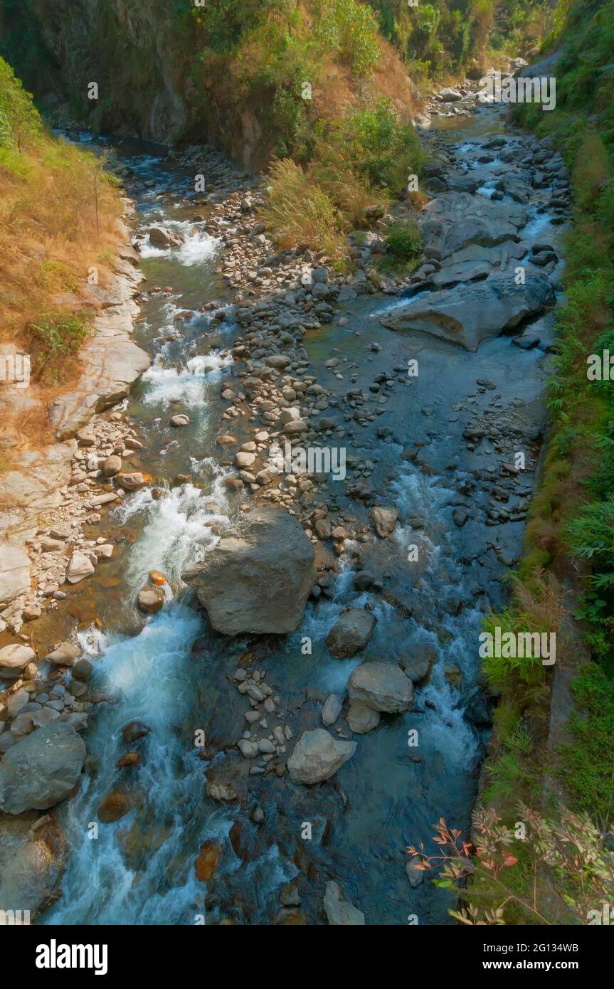 Confluence of Rongli and Reshi river, water flowing on rocks at Sikkim ...