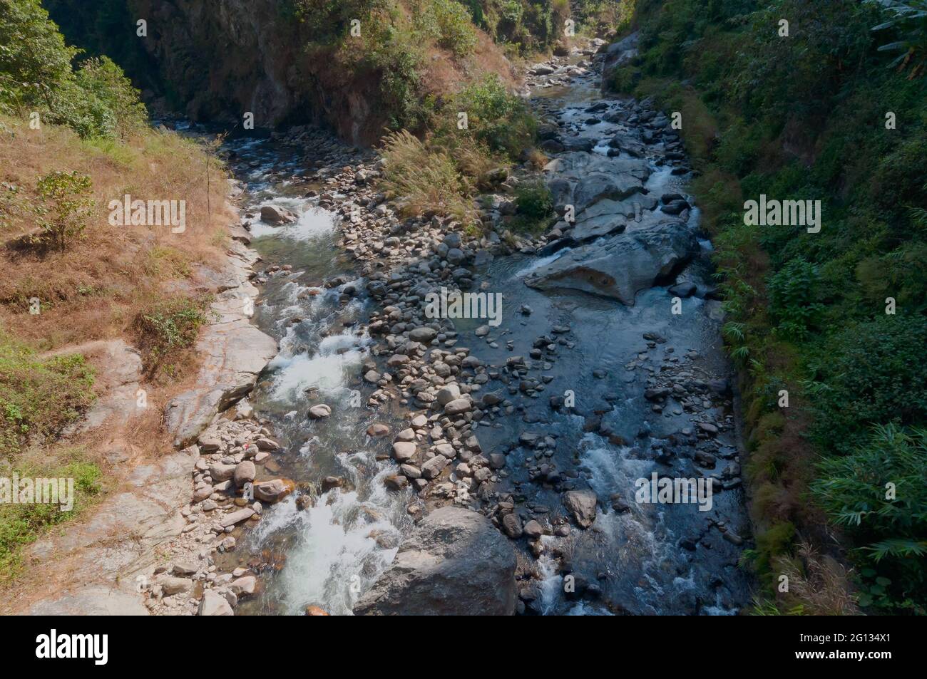 Confluence of Rongli and Reshi river, water flowing on rocks at Sikkim ...