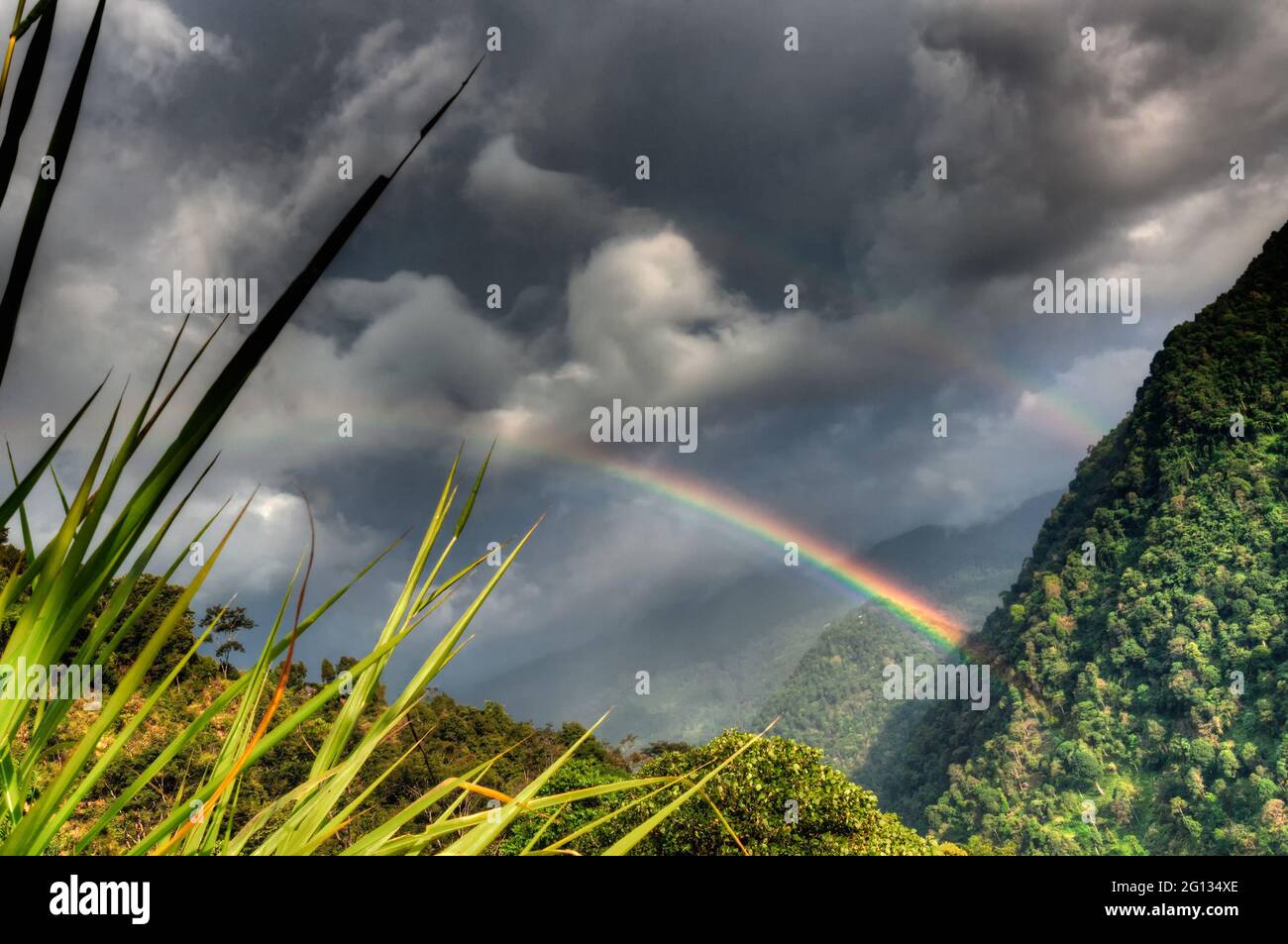 Beautiful rainbow on cloudy sky over Himalayan mountains at Sikkim ...