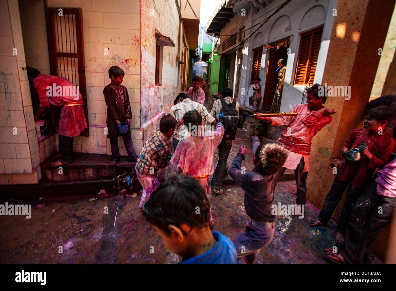 Indian people playing holi in the street of Barsana City of Uttar ...