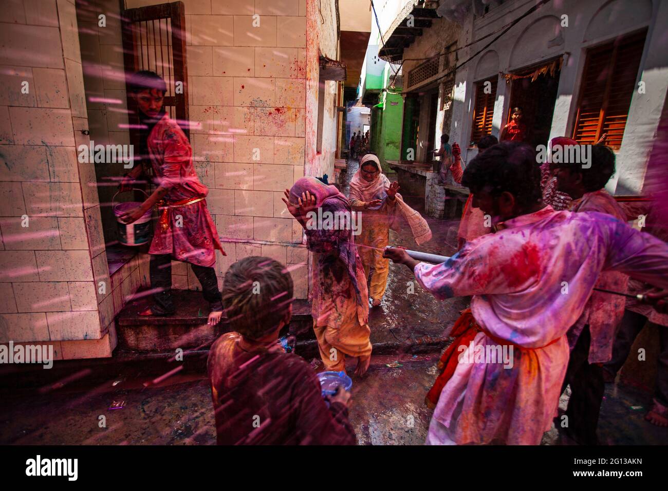 Indian people playing holi in the street of Barsana City of Uttar ...