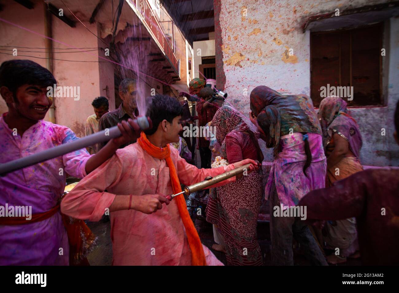 Indian people playing holi in the street of Barsana City of Uttar ...