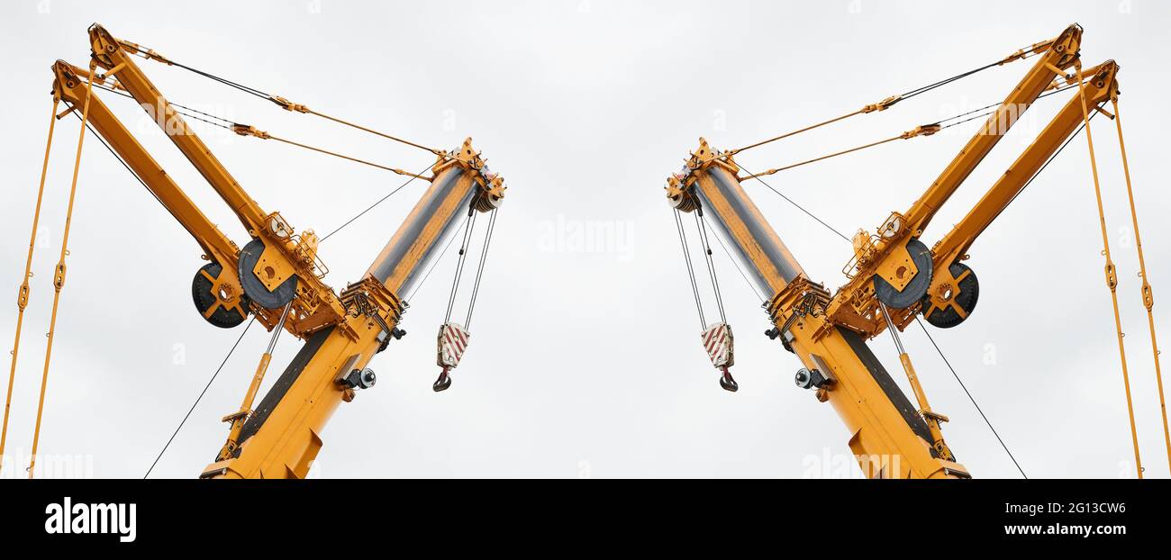 Yellow crane hook arm hi-res stock photography and images - Alamy