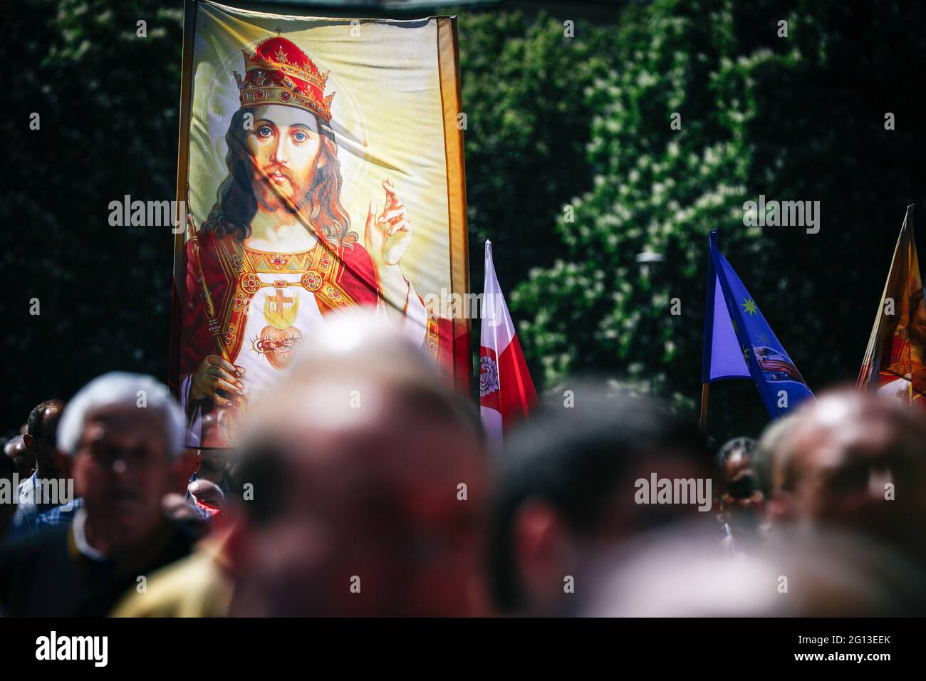 A flag with Jesus Christ, held by members of a radical Catholic and ...
