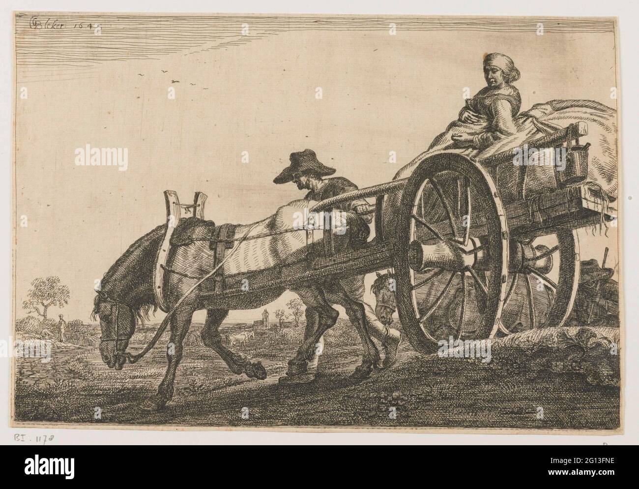 Farmer with two wheels on a horse cart. A farmer leads a horse cart ...