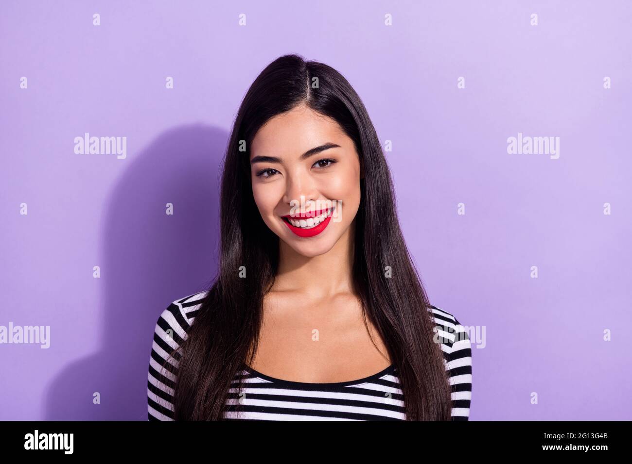 Photo of funny adorable young lady wear striped shirt smiling isolated ...