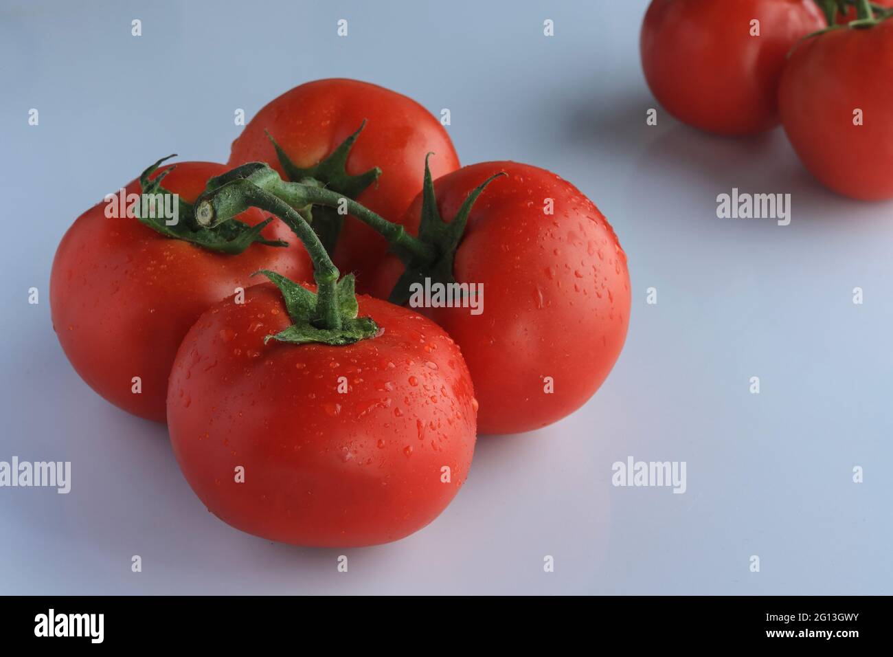 natural fresh tomato on a white background Stock Photo - Alamy