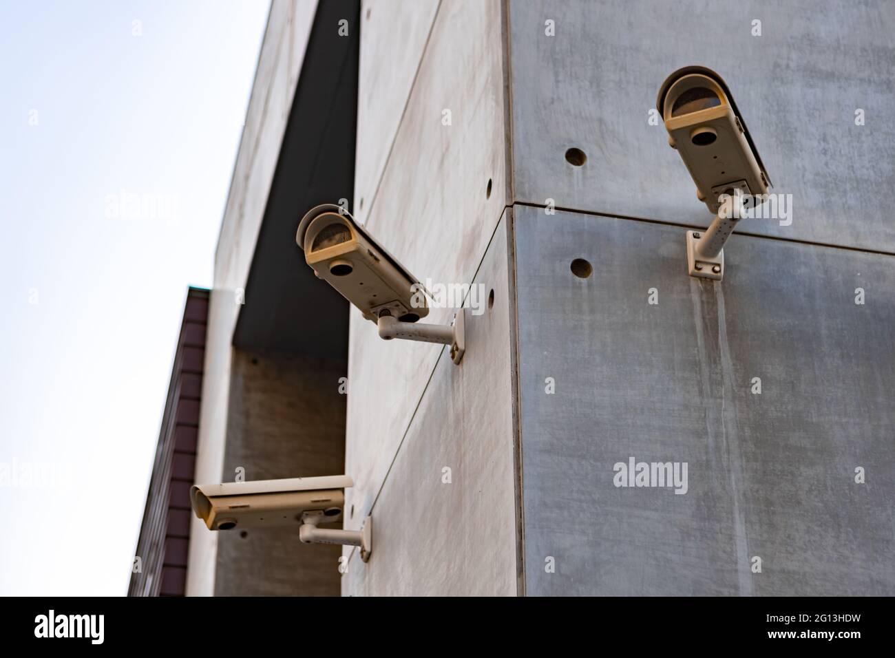 Security CCTV camera on facade of building Stock Photo - Alamy