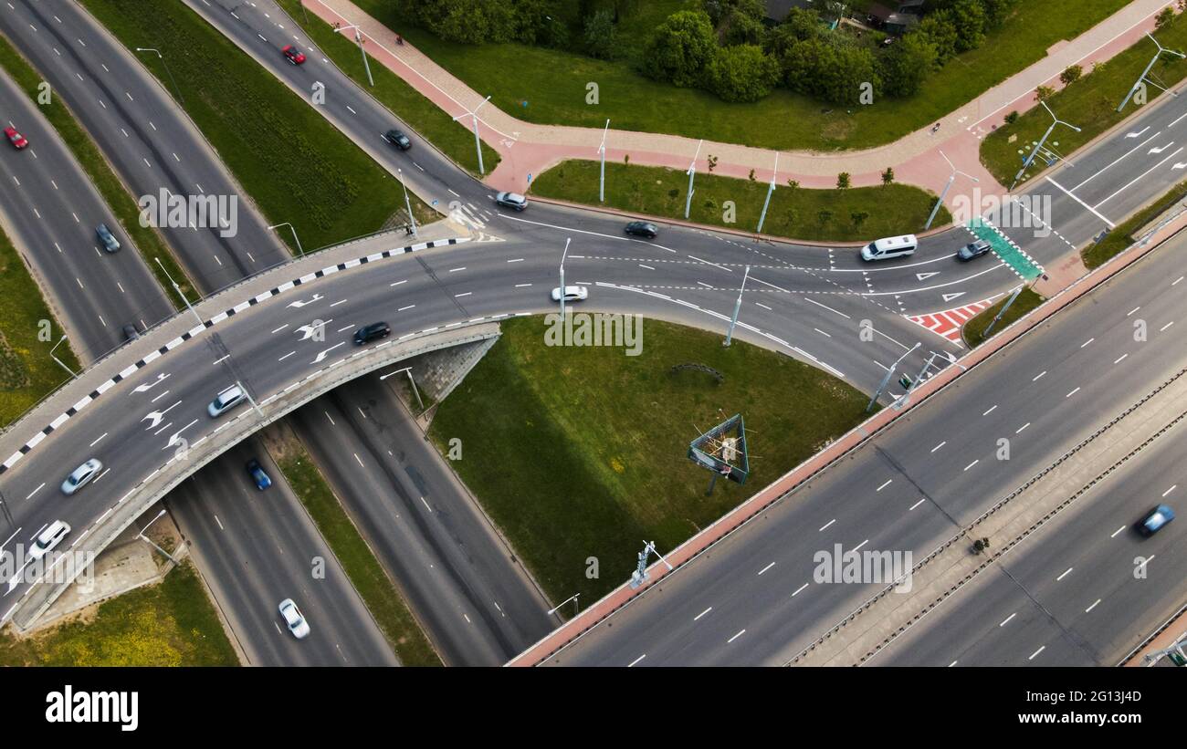 Flight over a multi-level road junction. Public transport is visible ...