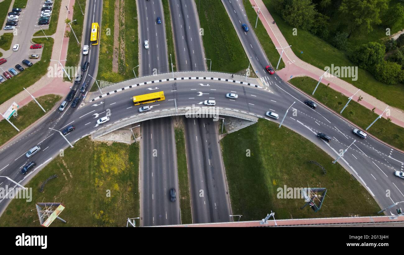 Flight over a multi-level road junction. Public transport is visible ...