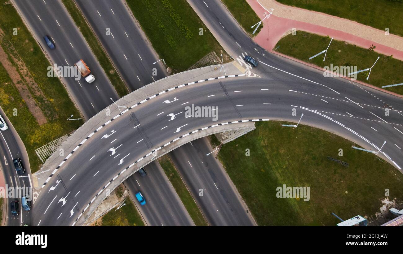 Flight over a multi-level road junction. Public transport is visible ...