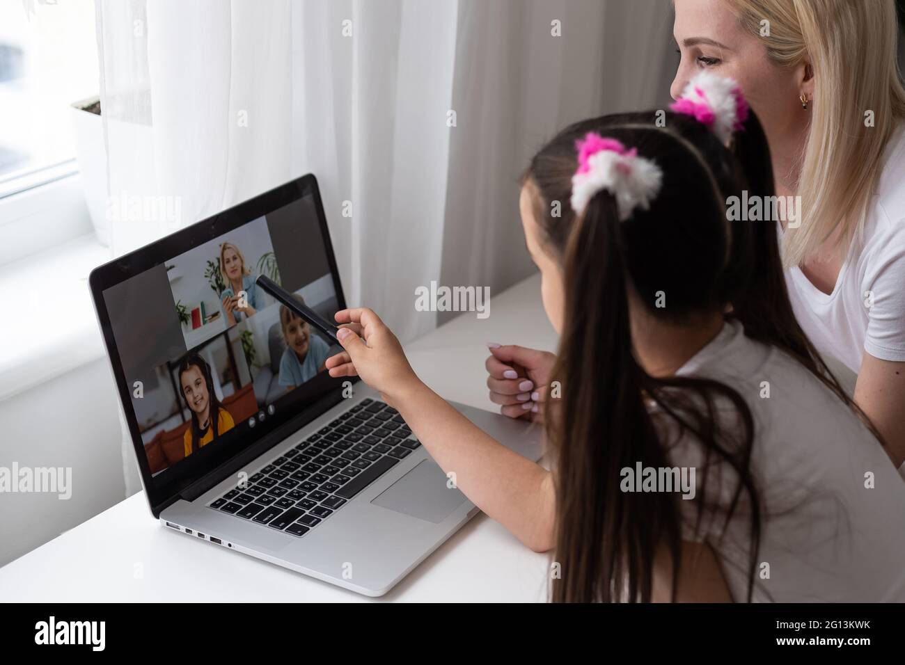 Online education of children. Mother and daughter of preschool watching ...