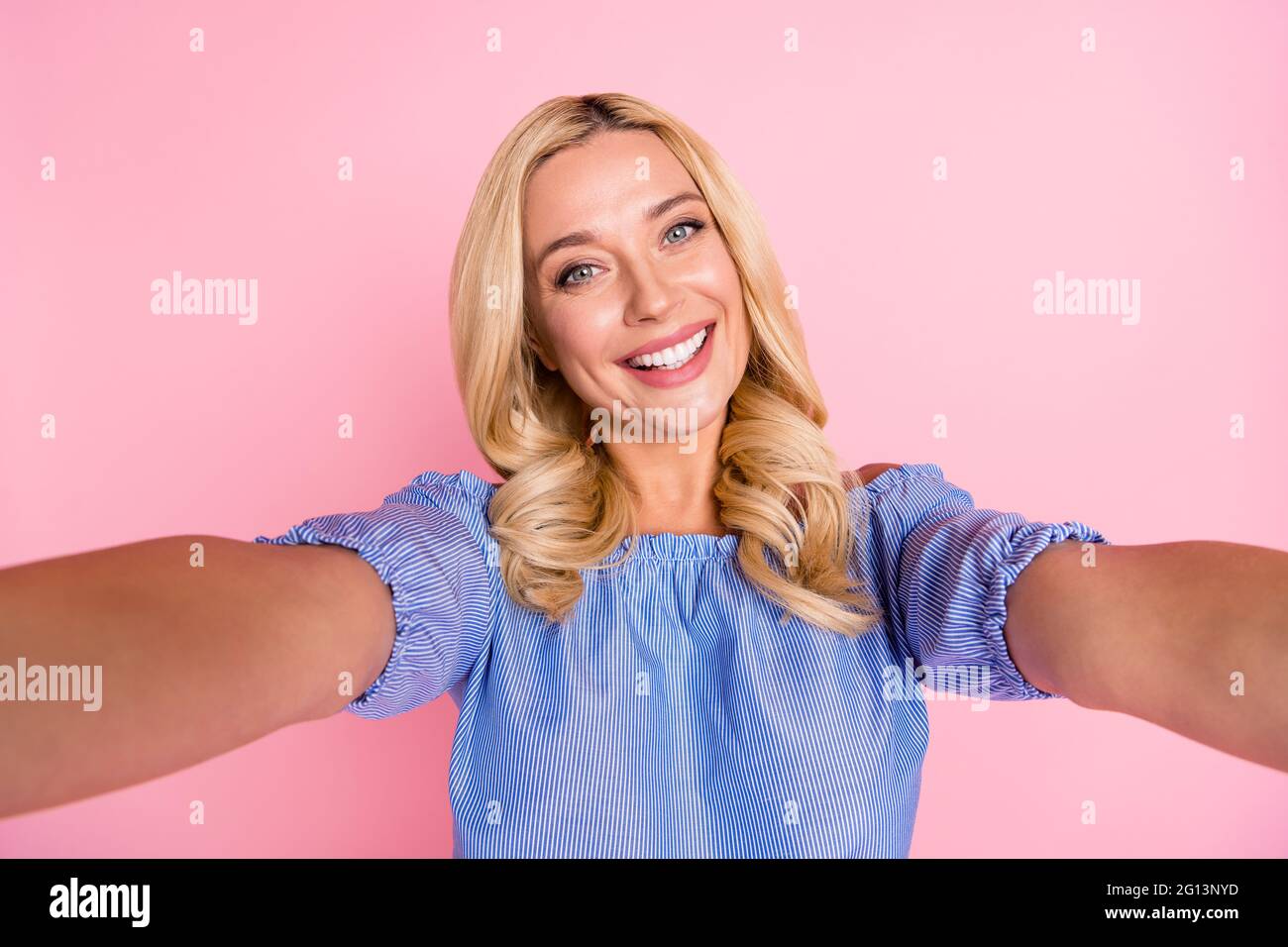 Self Portrait Of Attractive Cheerful Wavy Haired Woman Having Fun