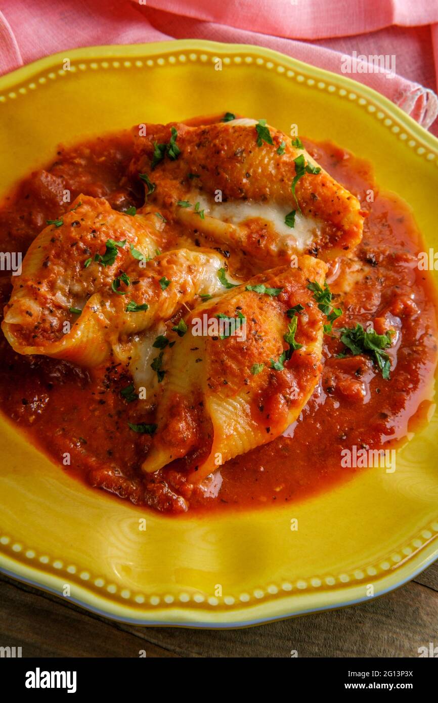 Italian stuffed conchiglioni shell pasta baked in marinara tomato sauce ...