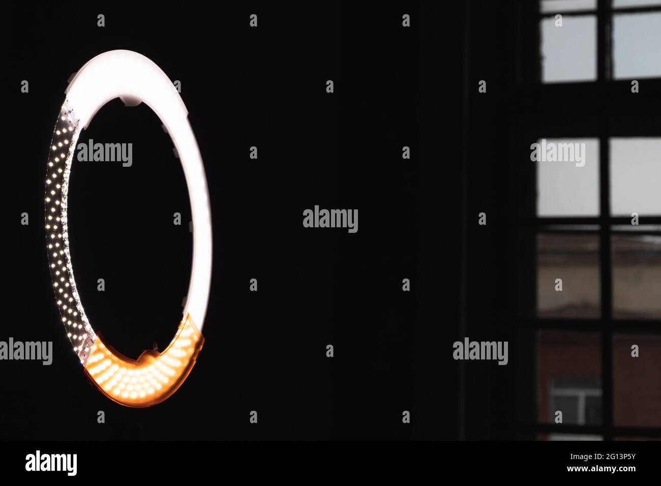 Circular LED light glowing in dark photo studio Stock Photo - Alamy